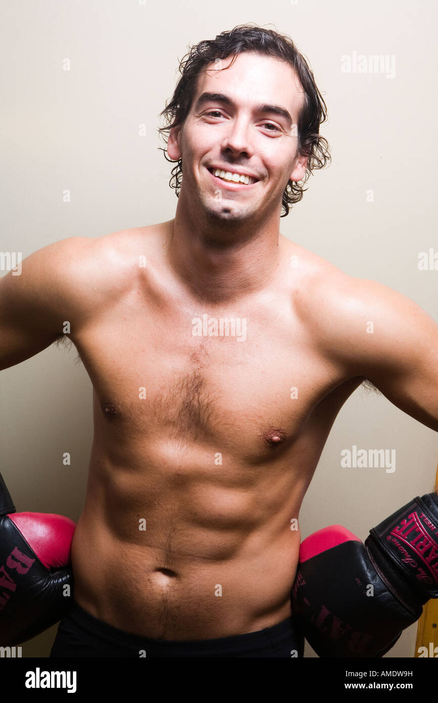 boxer smiling with hands on hips Stock Photo - Alamy