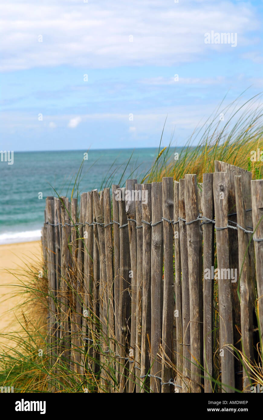 Old wooden fence on a beach in Brittany France Stock Photo - Alamy
