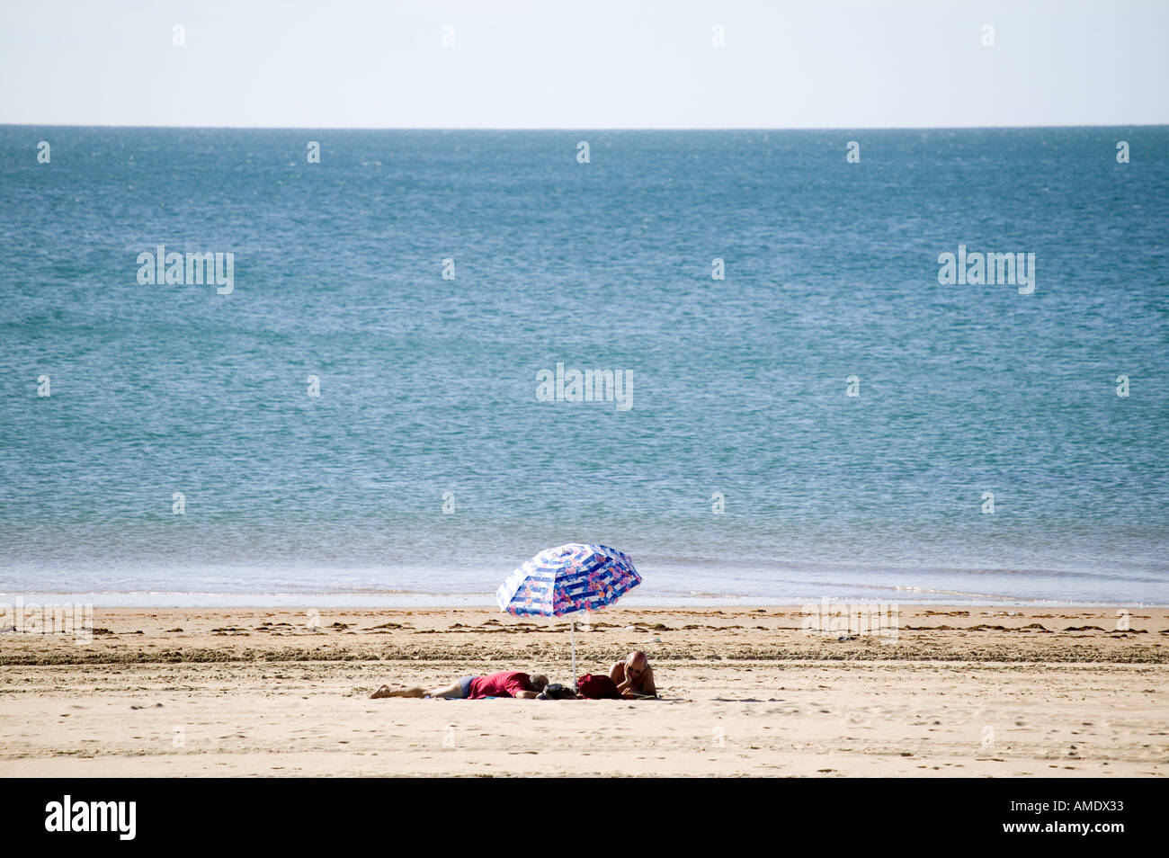 Tourists on a beach in the Spanish costal area of Islantilla Stock ...