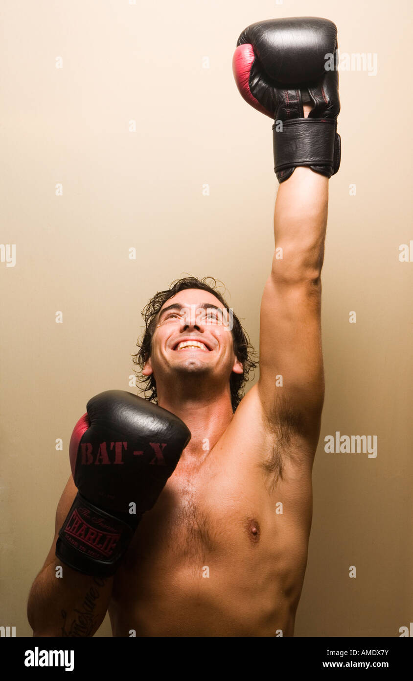Boxer with arm up in victory Stock Photo - Alamy