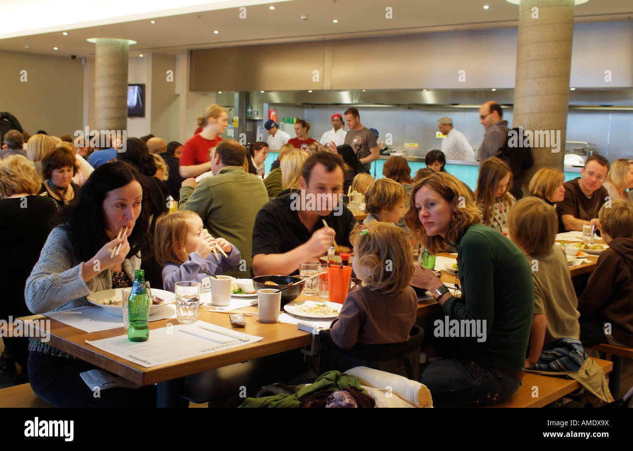Crowded Restaurant with Customers Eating at a Wagamama Noodle Bar ...