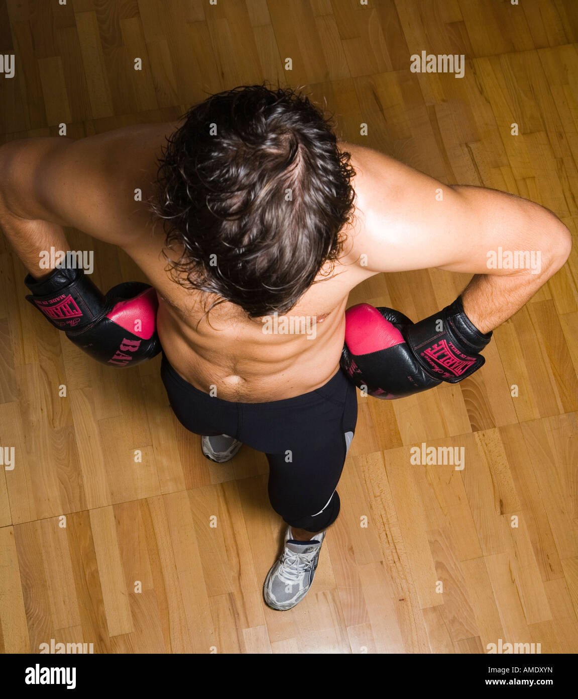 boxer looking down showing his abdominals Stock Photo - Alamy