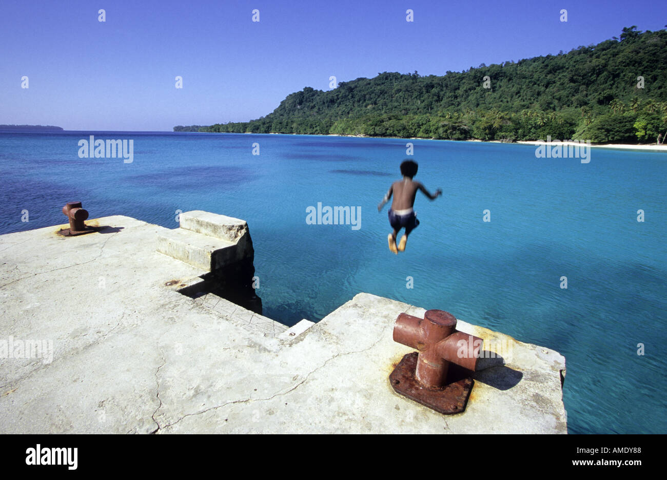 Child jumping into sea Champagne Beach Espiritu Santo Vanuatu Stock ...