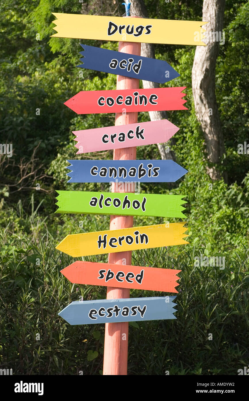 Colourful signpost showing the names of illegal and legal addictive ...