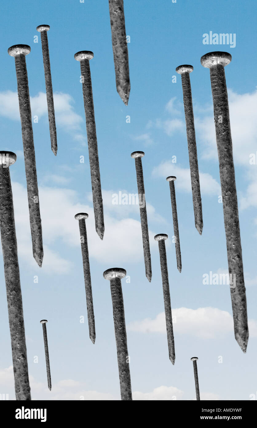 a surreal picture of nails falling from the sky Stock Photo - Alamy