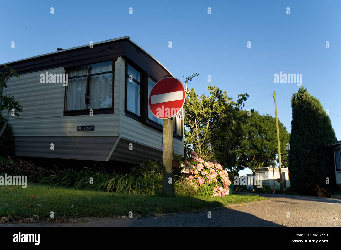 Low angle view of a caravan with a no entry sign in the early evening ...