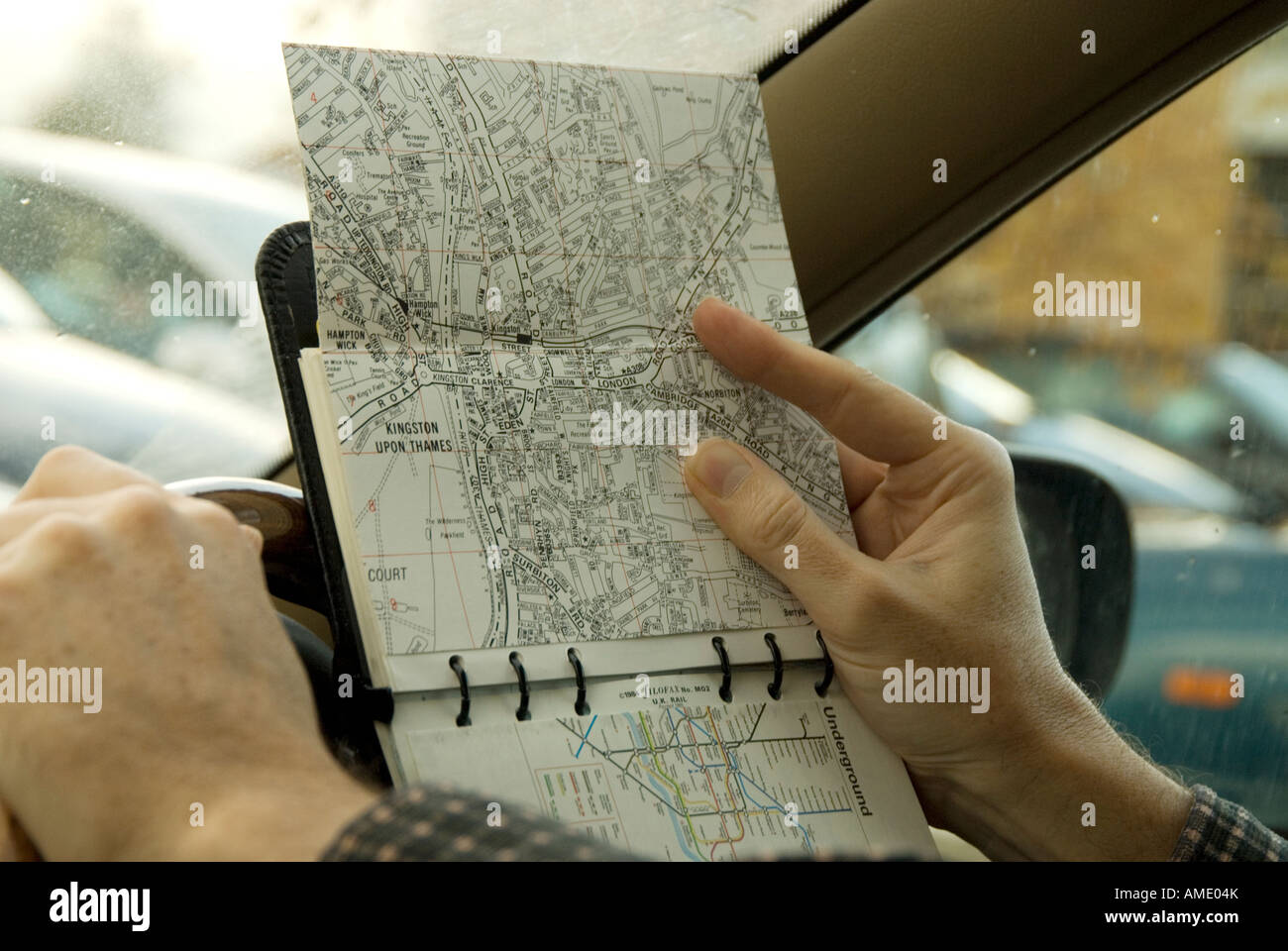 reading a map while driving Stock Photo - Alamy