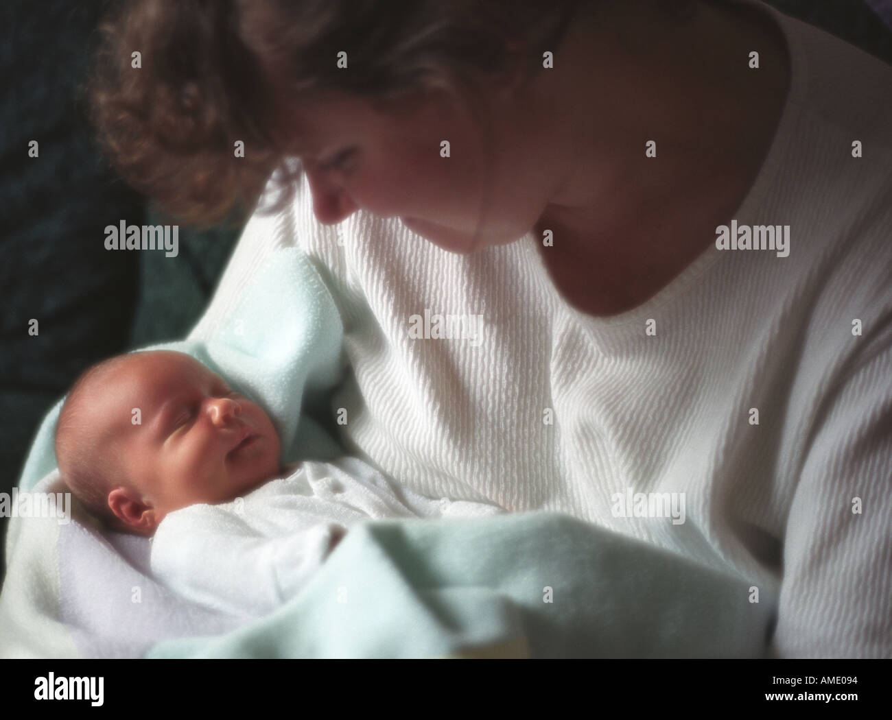 new born baby 4 weeks old asleep with her mother Stock Photo - Alamy
