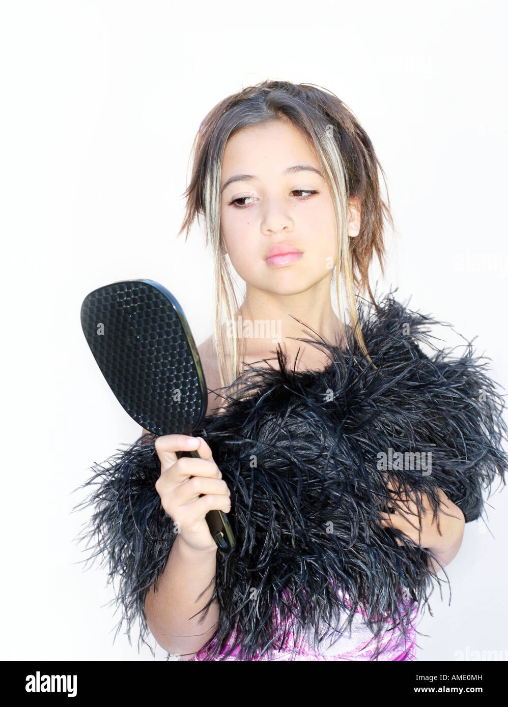 Girl checking her makeup in the mirror Stock Photo - Alamy