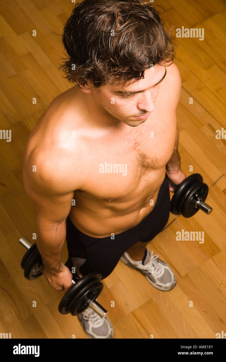 man training at home with weights Stock Photo - Alamy