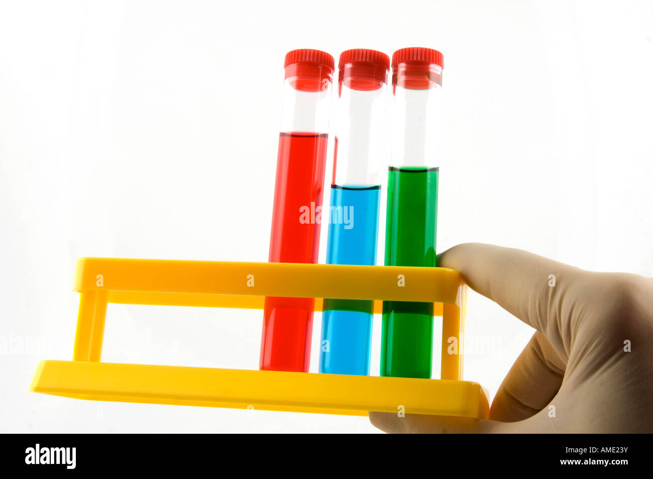 three test tubes in a rack Stock Photo - Alamy