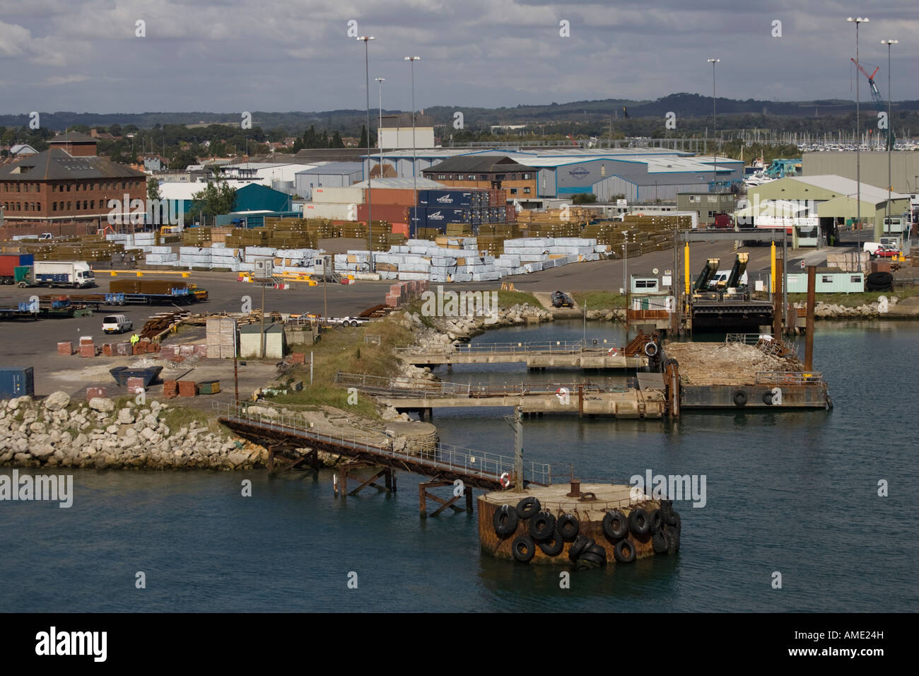 Dockside at port with moorings containers and warehouses Poole Harbour ...