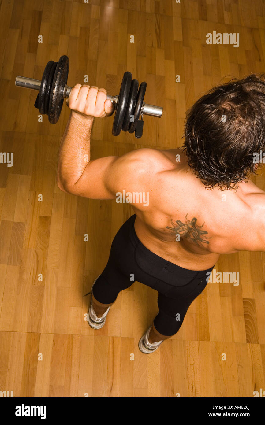 man weight lifting seen from behind Stock Photo - Alamy