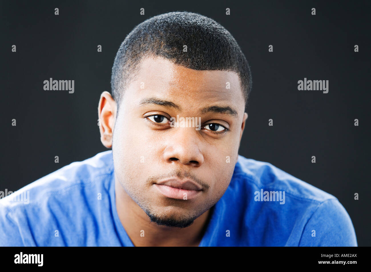 Portrait of contemplative young man Stock Photo - Alamy