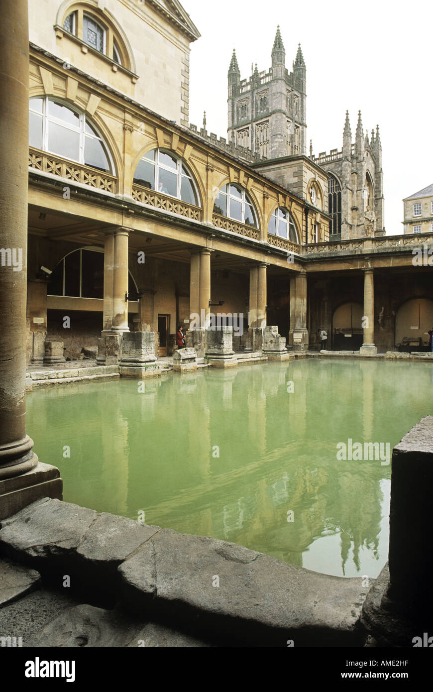 Roman baths with 16th century Bath Abbey in background Stock Photo - Alamy