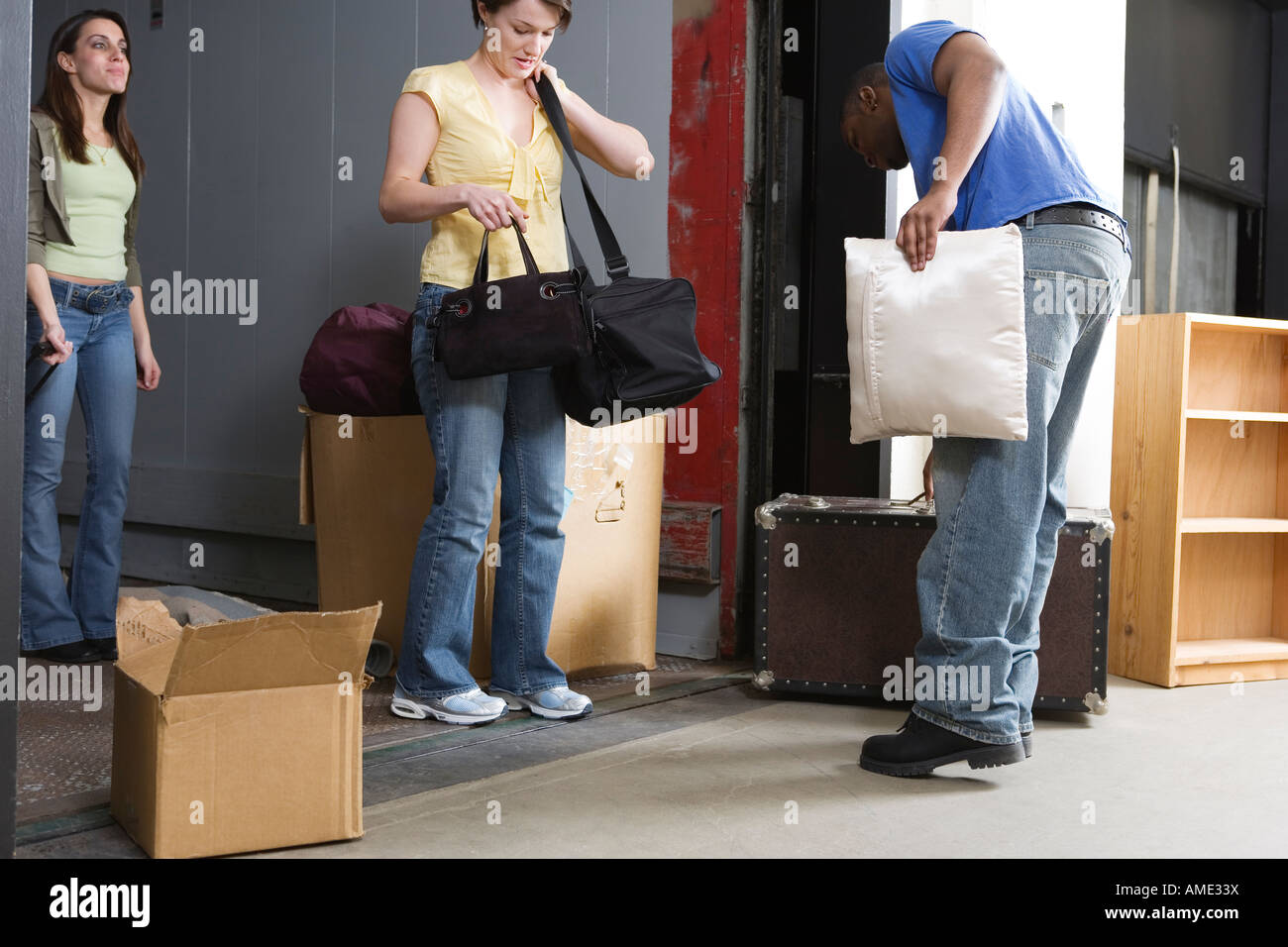 Friends moving out with their belongings Stock Photo - Alamy