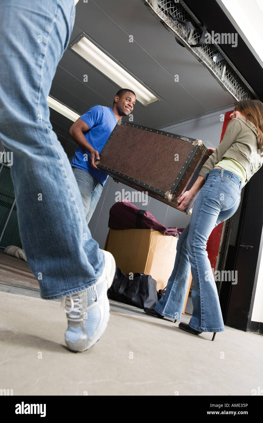 People moving bags and boxes hi-res stock photography and images - Alamy