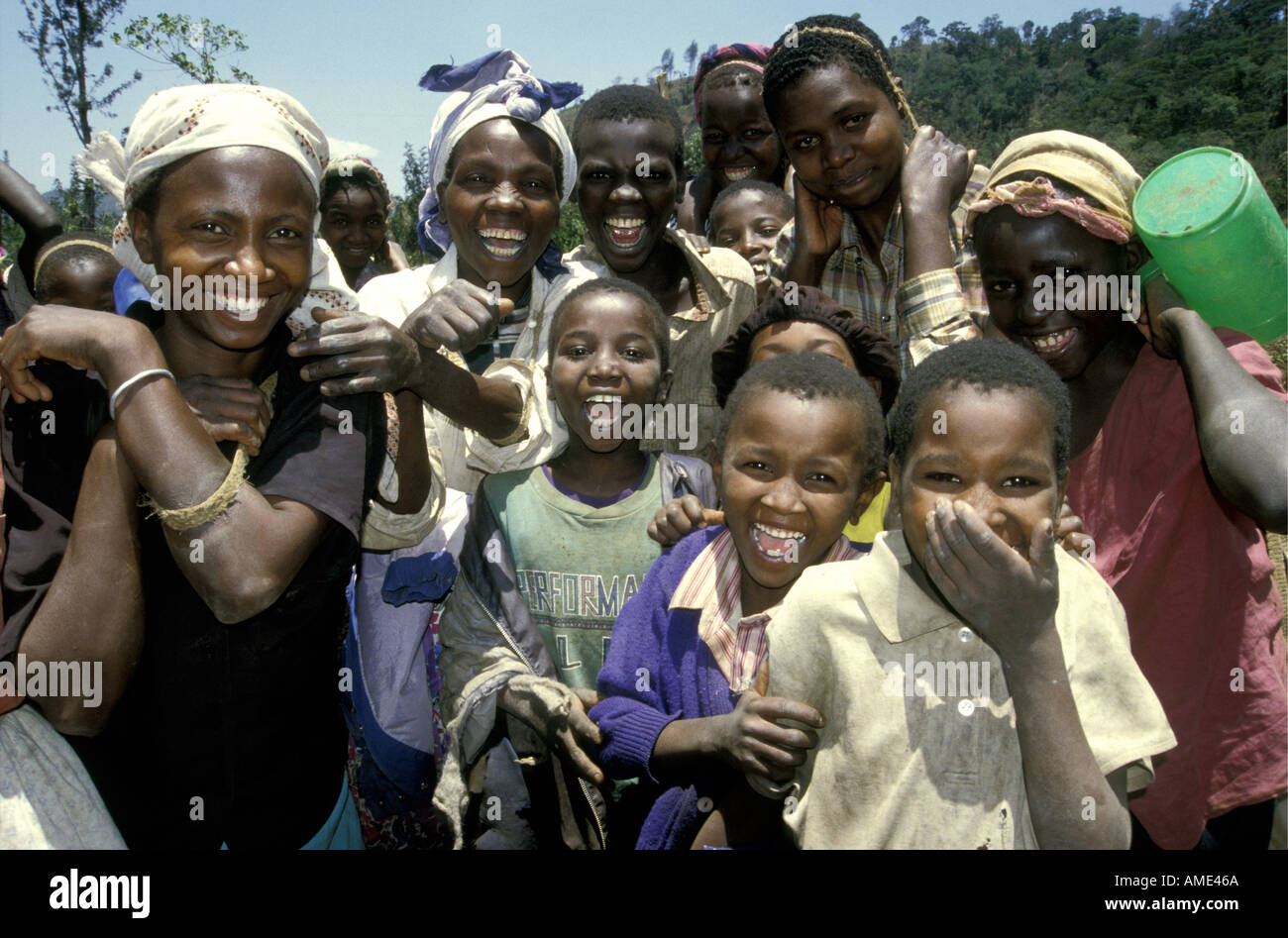 Happy Meru people gathered at a water point Mwea Meru District Kenya ...