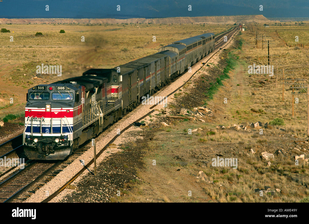 An Amtrak passenger train crosses the desert in California Stock Photo ...