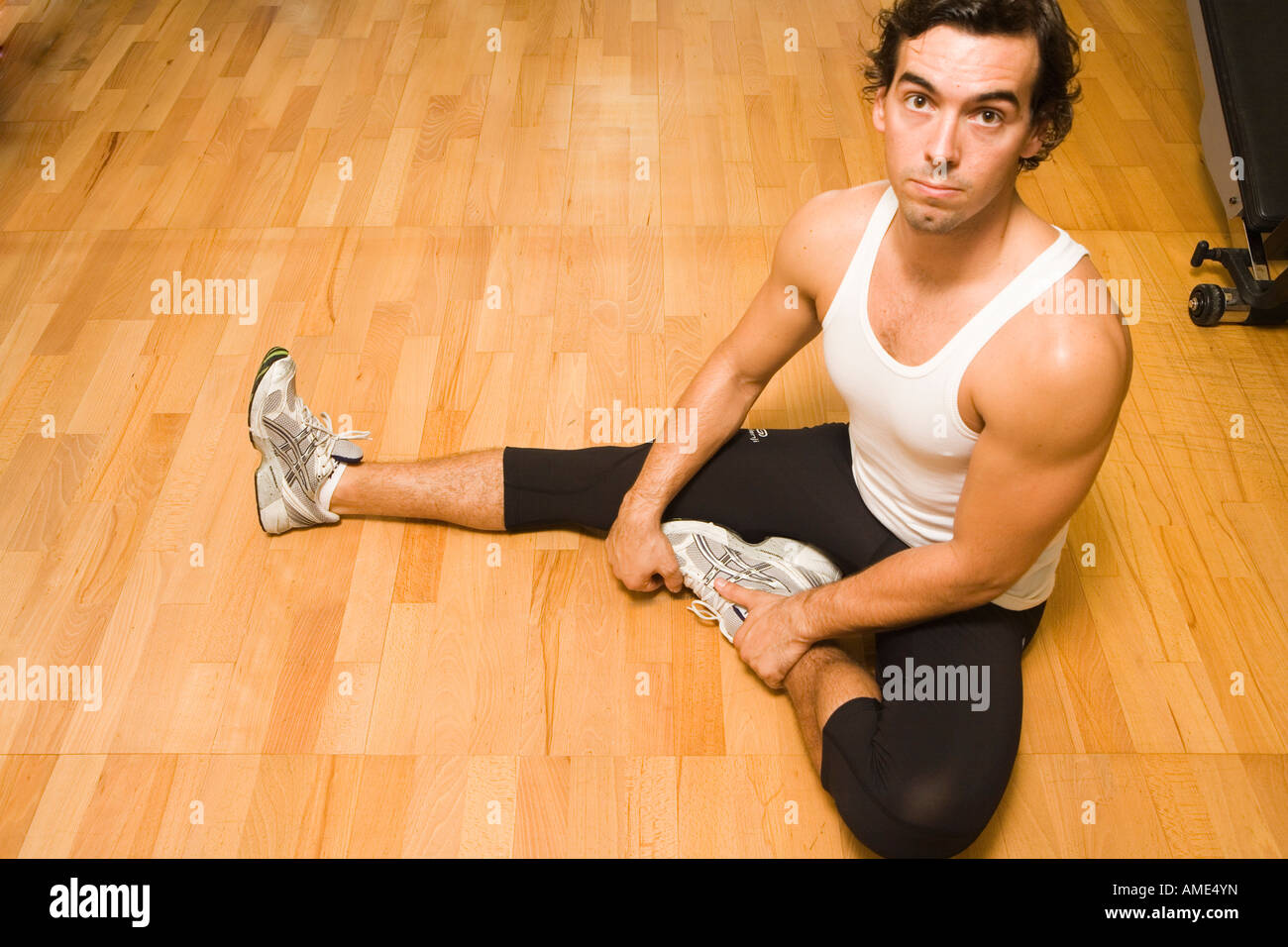 man stretching looking at camera Stock Photo - Alamy