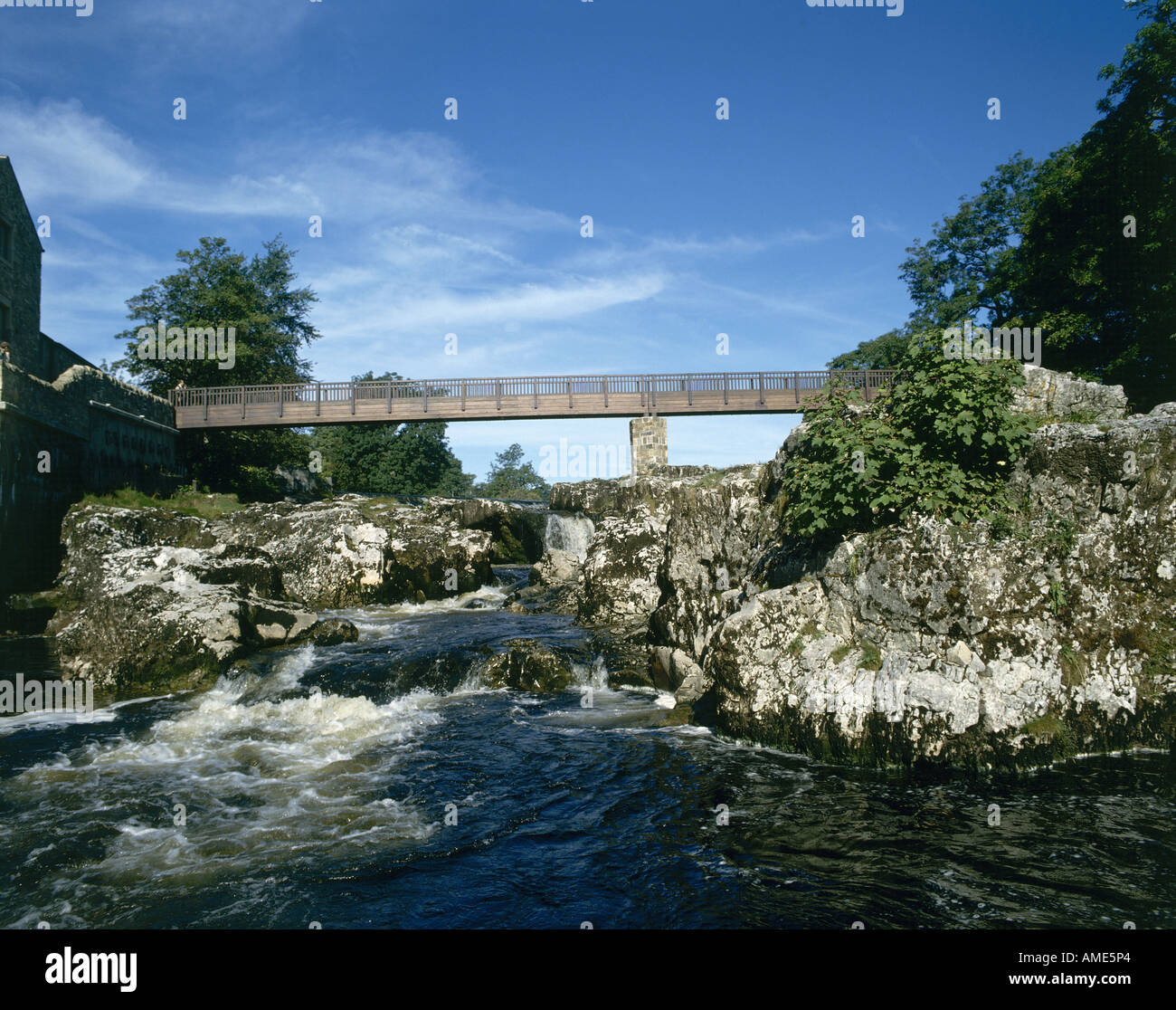 A bridge spanning Linton Falls Grassington Stock Photo - Alamy