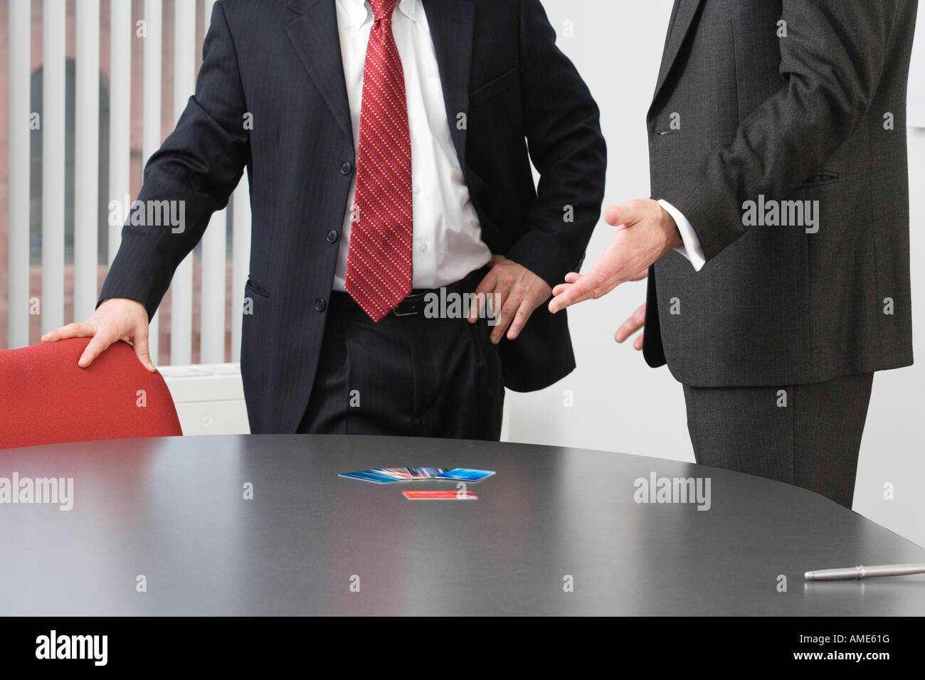 Business men with credit cards on the table Stock Photo - Alamy