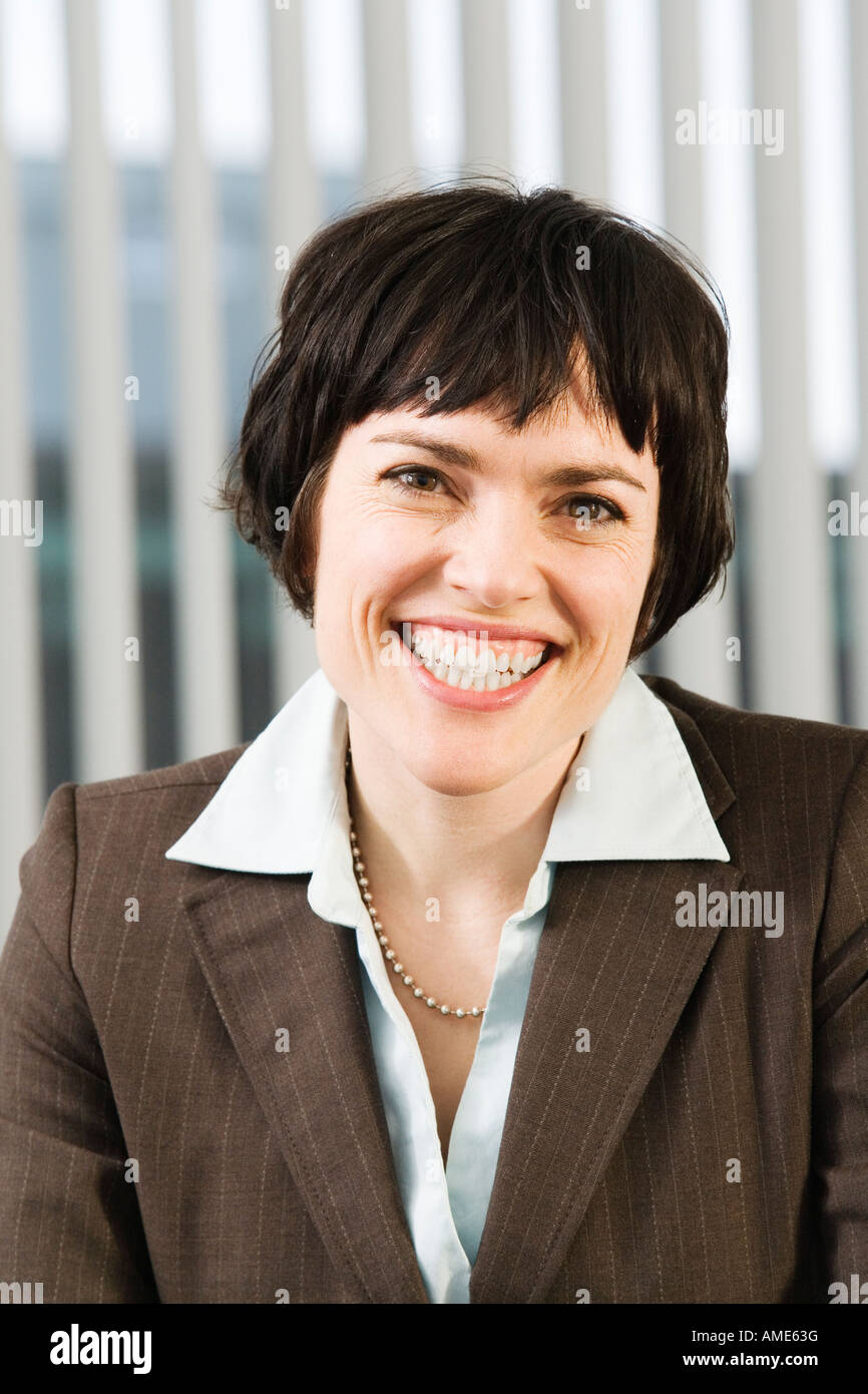 Portrait of a business woman smiling Stock Photo - Alamy
