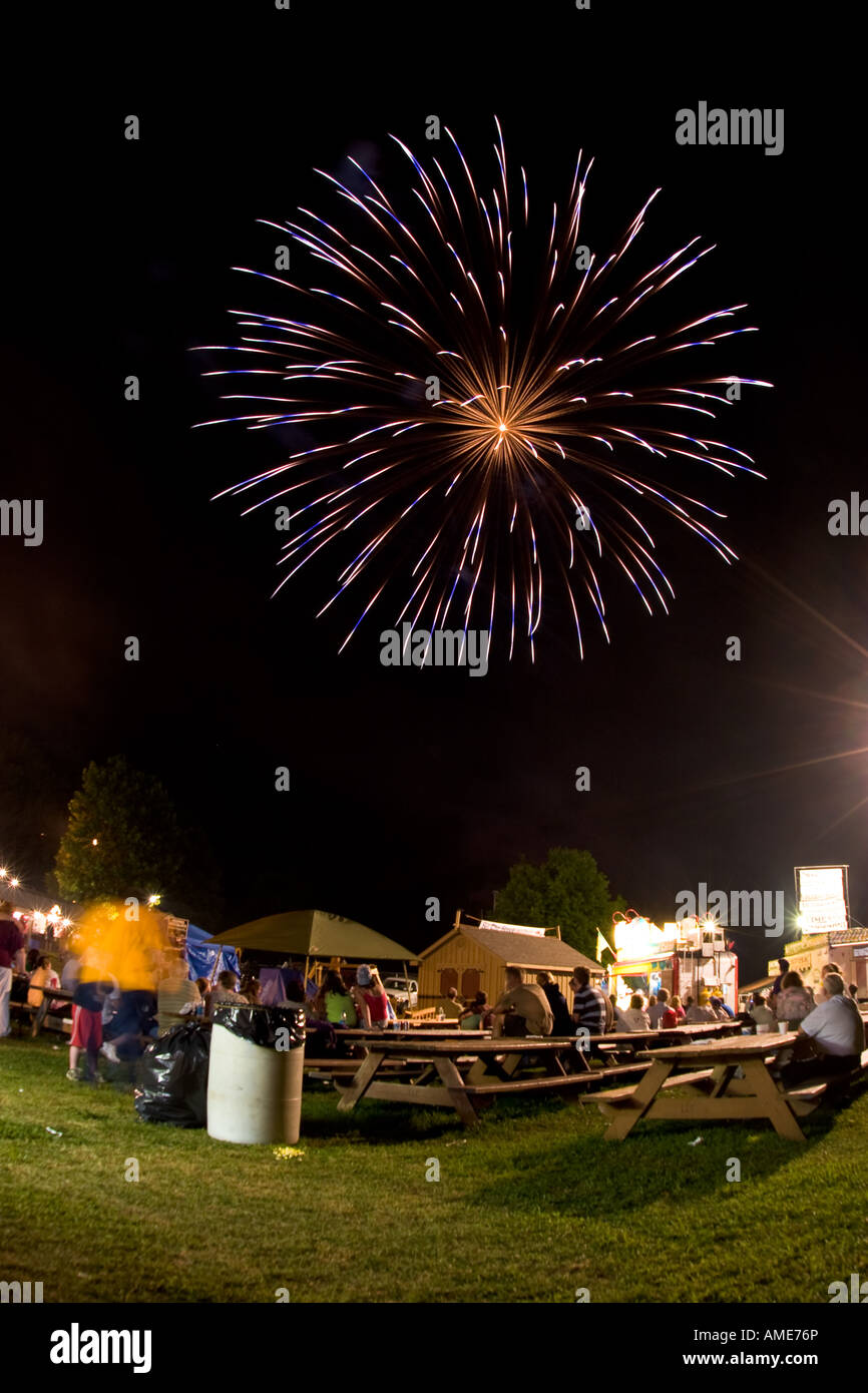 Fair goers enjoy the fireworks display Stock Photo - Alamy