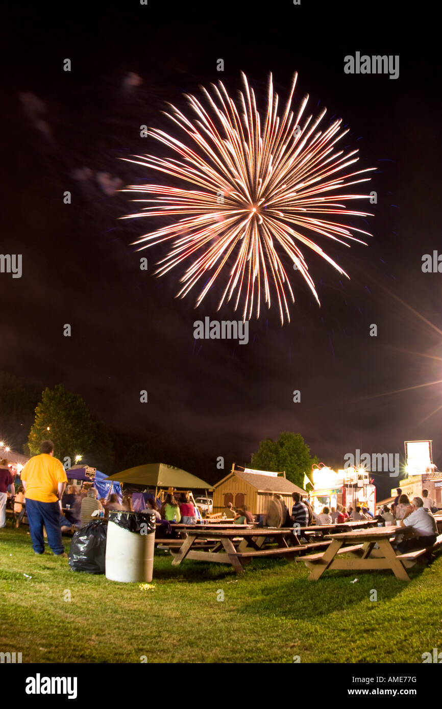 Fair goers enjoy the fireworks display Stock Photo - Alamy