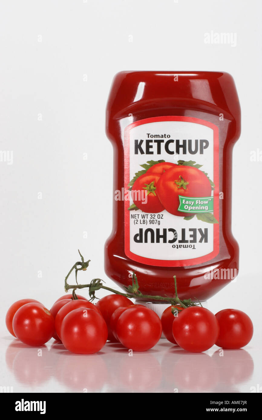 Single bottle tomato ketchup with red ripe cherry tomatoes isolated cut out cutout pictures ...