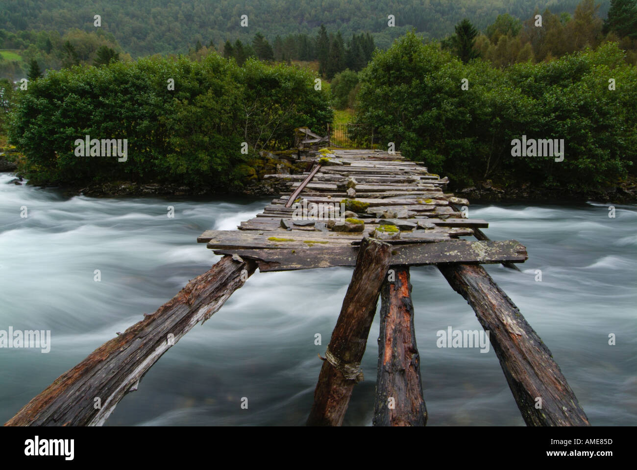 Broken bridge over River near Vallestadfossen during heavy rain in ...