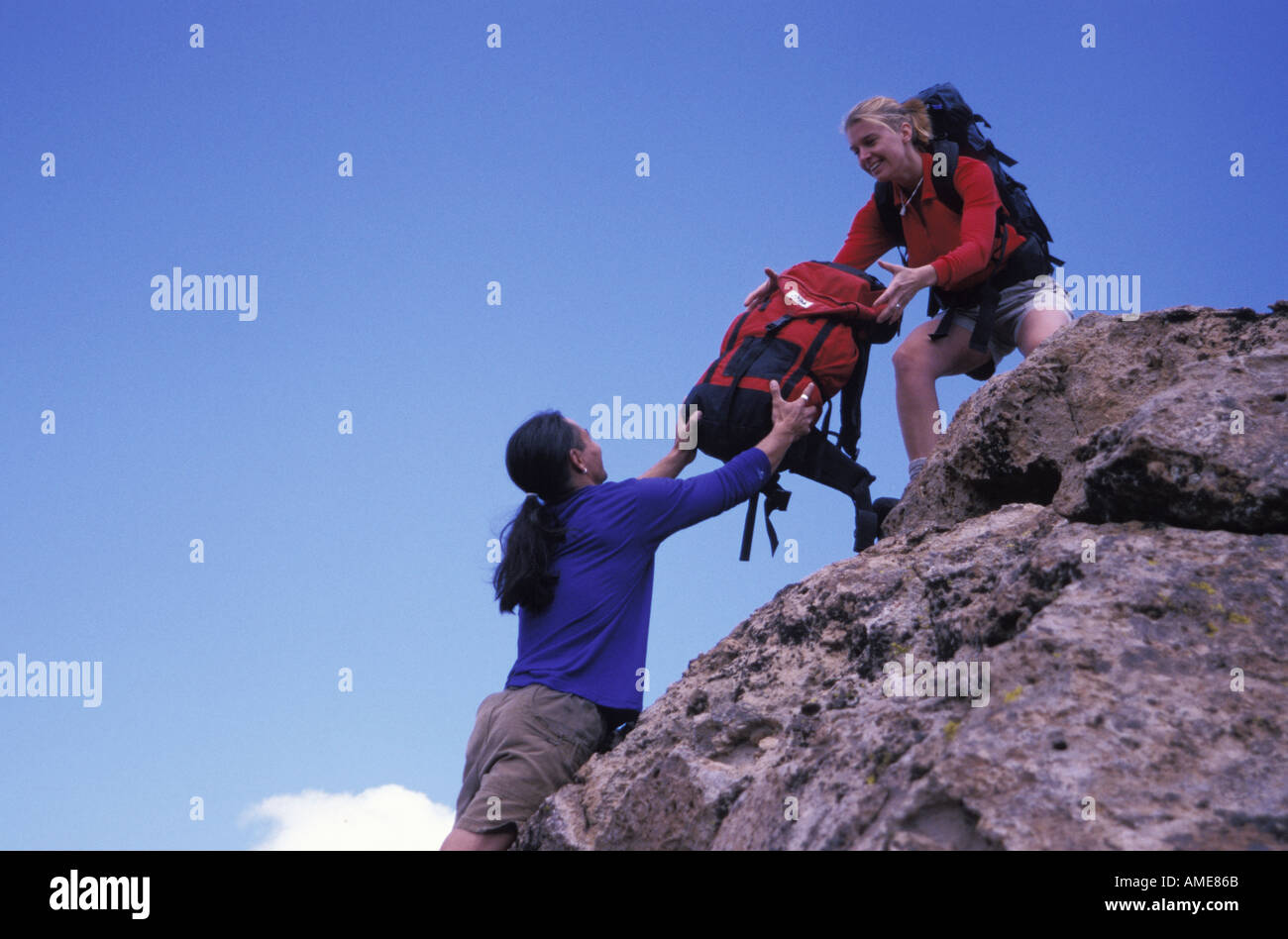 Handing backpack hi-res stock photography and images - Alamy