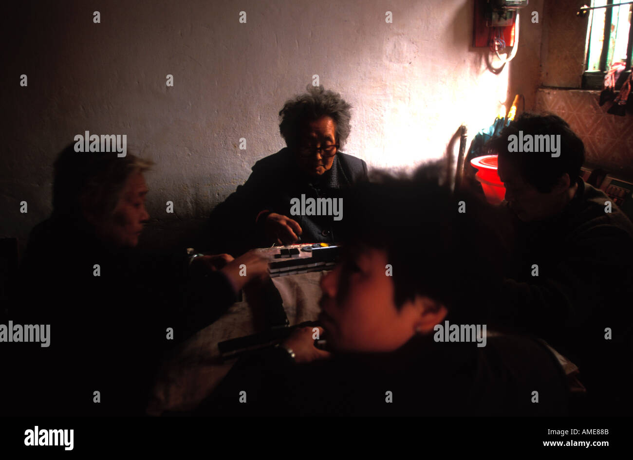 Woman playing mahjong hi-res stock photography and images - Alamy