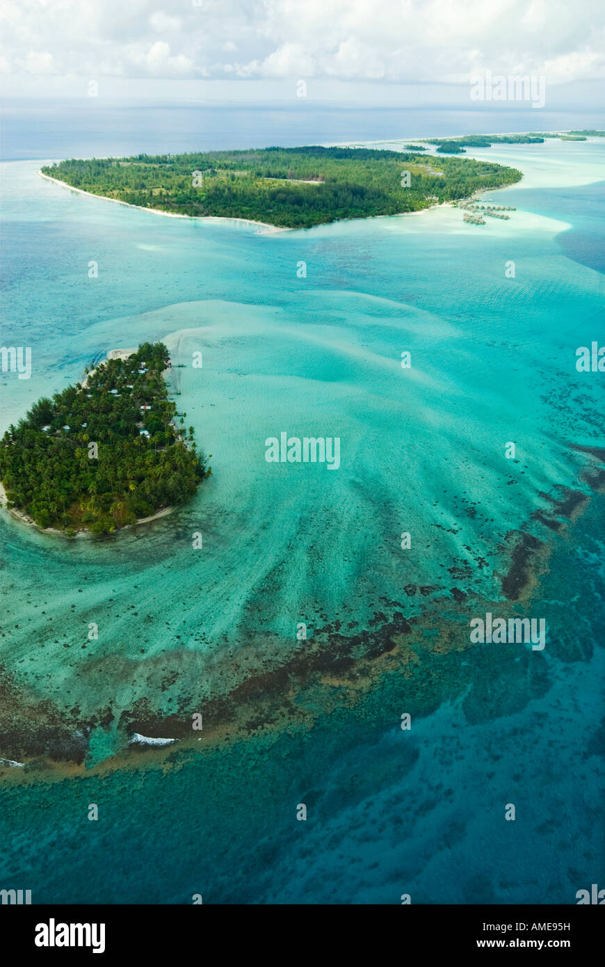 Bora Bora, French Polynesia. Aerial of Motu Tapu center left and Motu ...