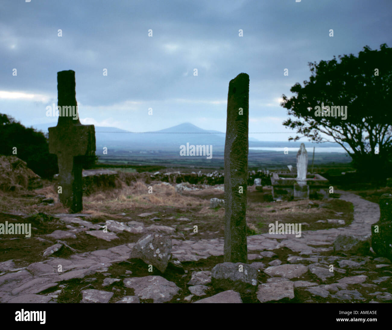 Ancient slab cross and Ogham stone, Kilmalkedar churchyard, near ...