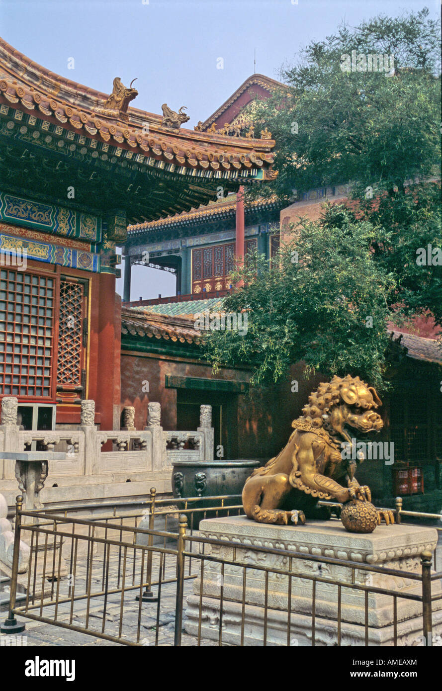golden lion (qi lin) and buildings Stock Photo - Alamy