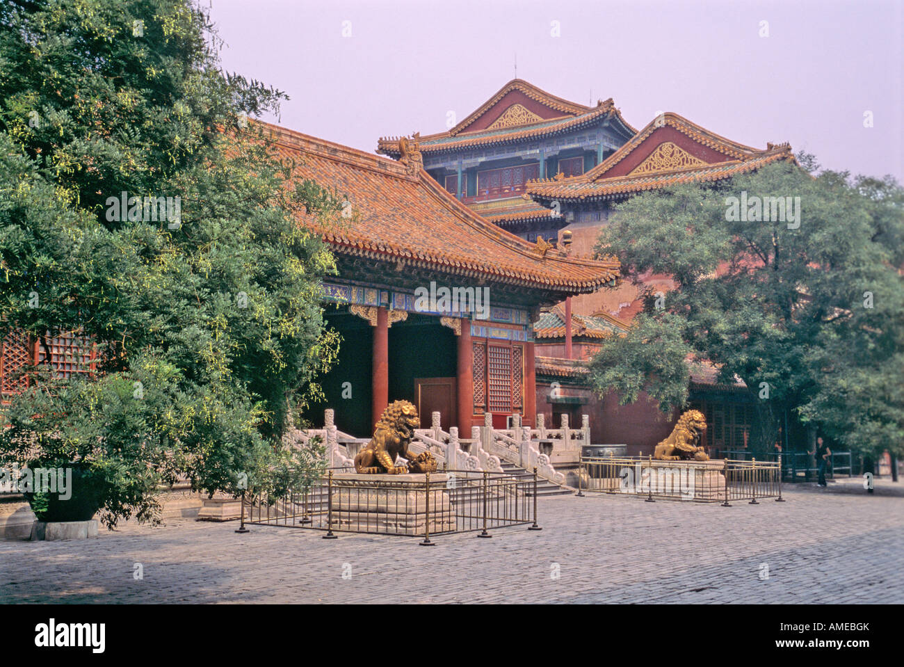 ancient buildings and golden lion (qi lin) statues Stock Photo - Alamy