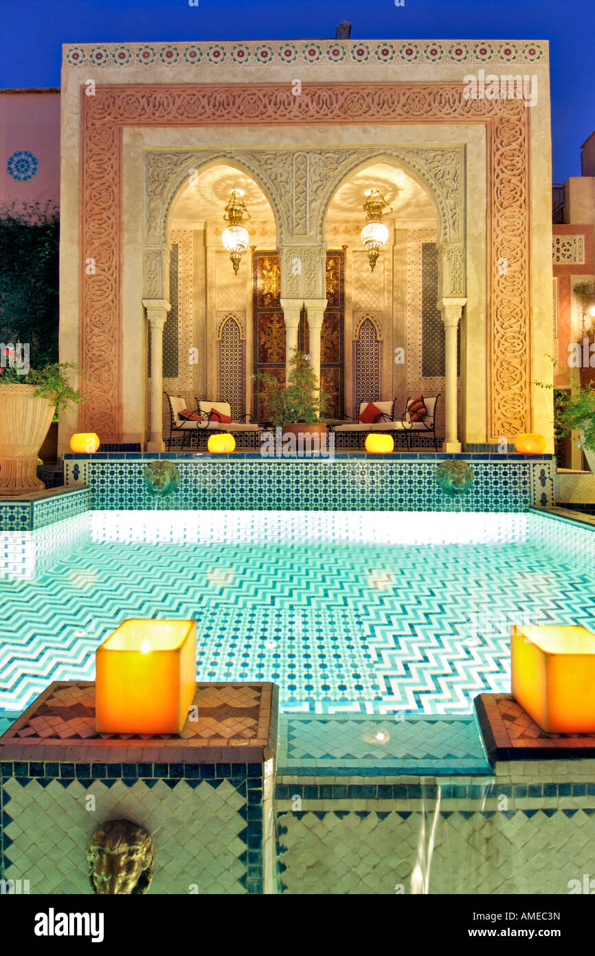 Dusk view of the pool and relaxation area in the Palais Sebban riad in ...