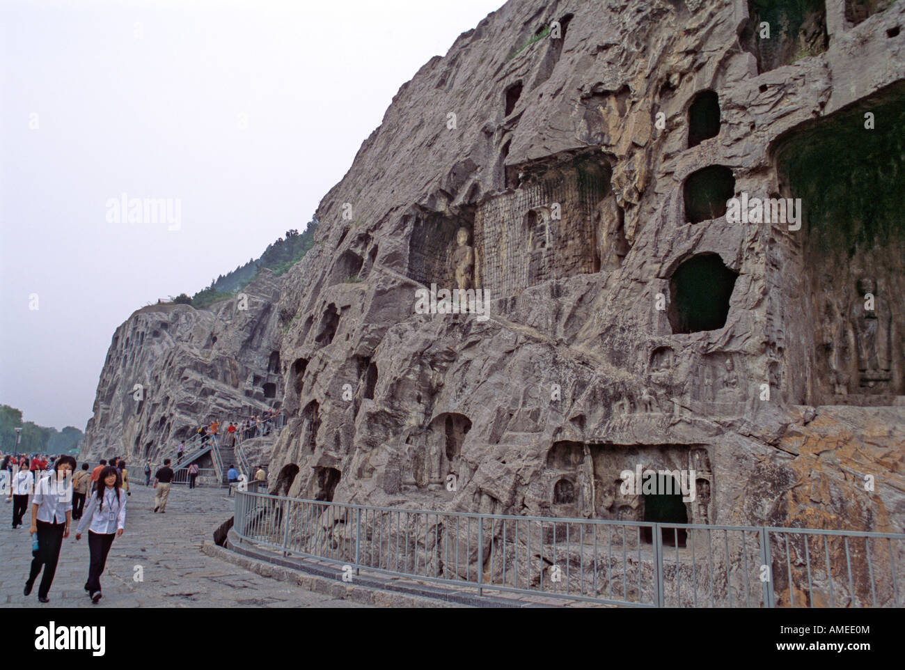 tourists visiting the longmen caves Stock Photo - Alamy