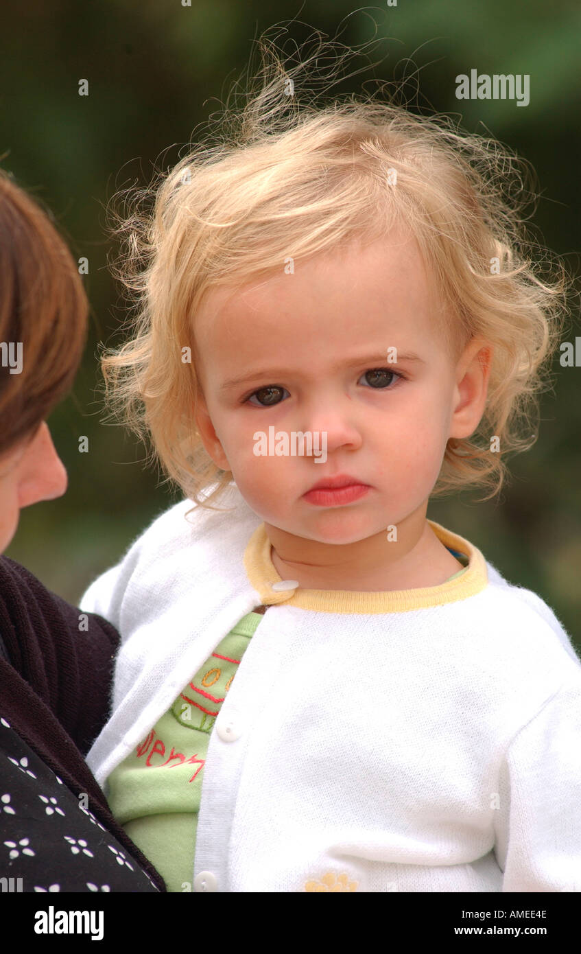 Toddler being held in her Mother's arms Stock Photo - Alamy