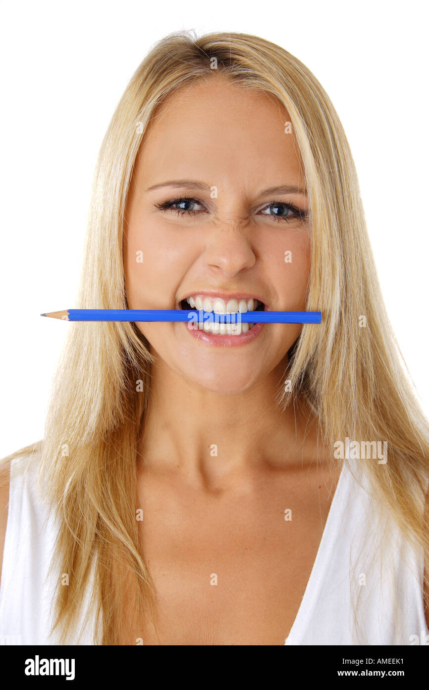blond woman with pencil between her teeth Stock Photo - Alamy