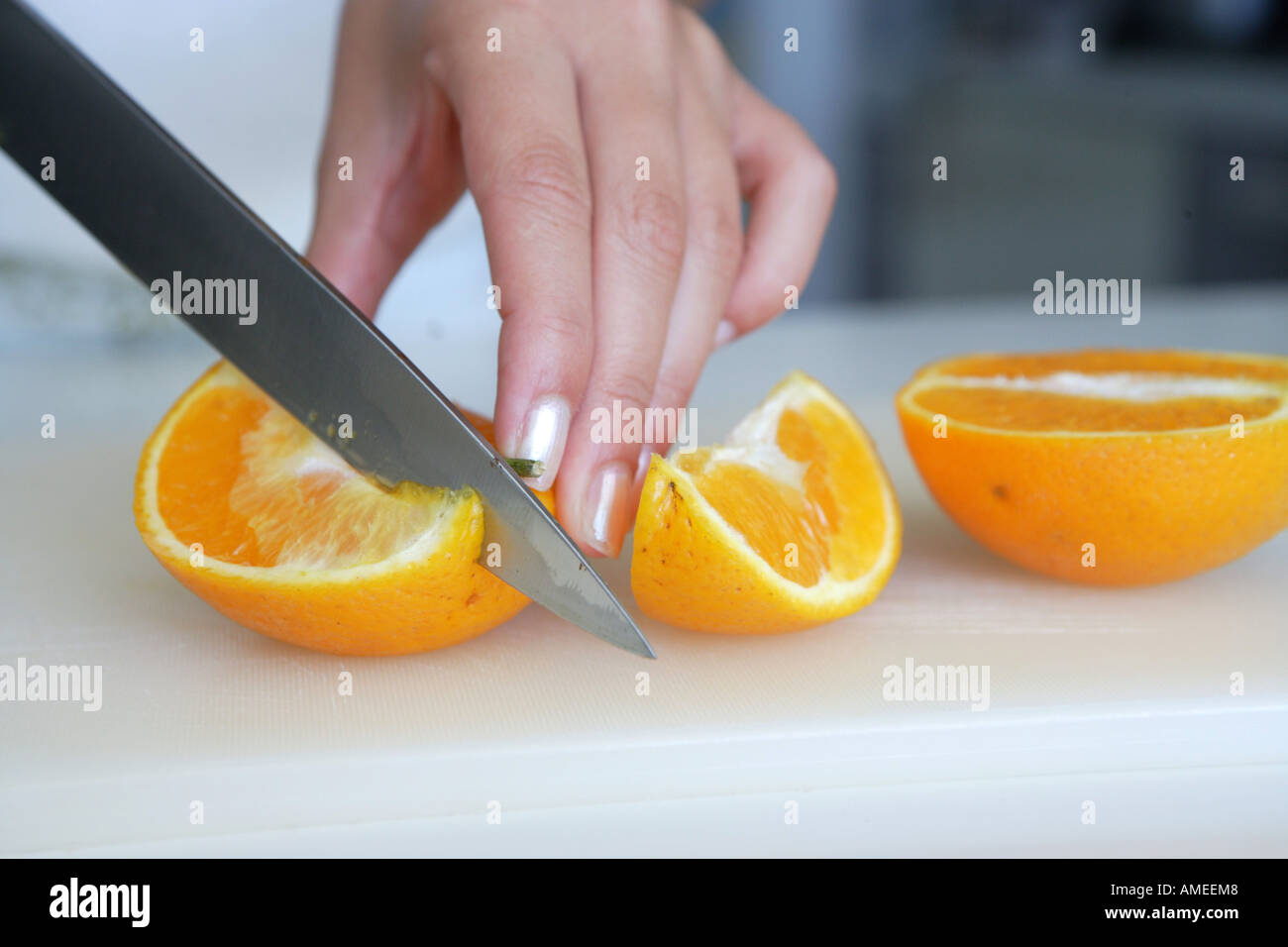 cutting an orange Stock Photo - Alamy
