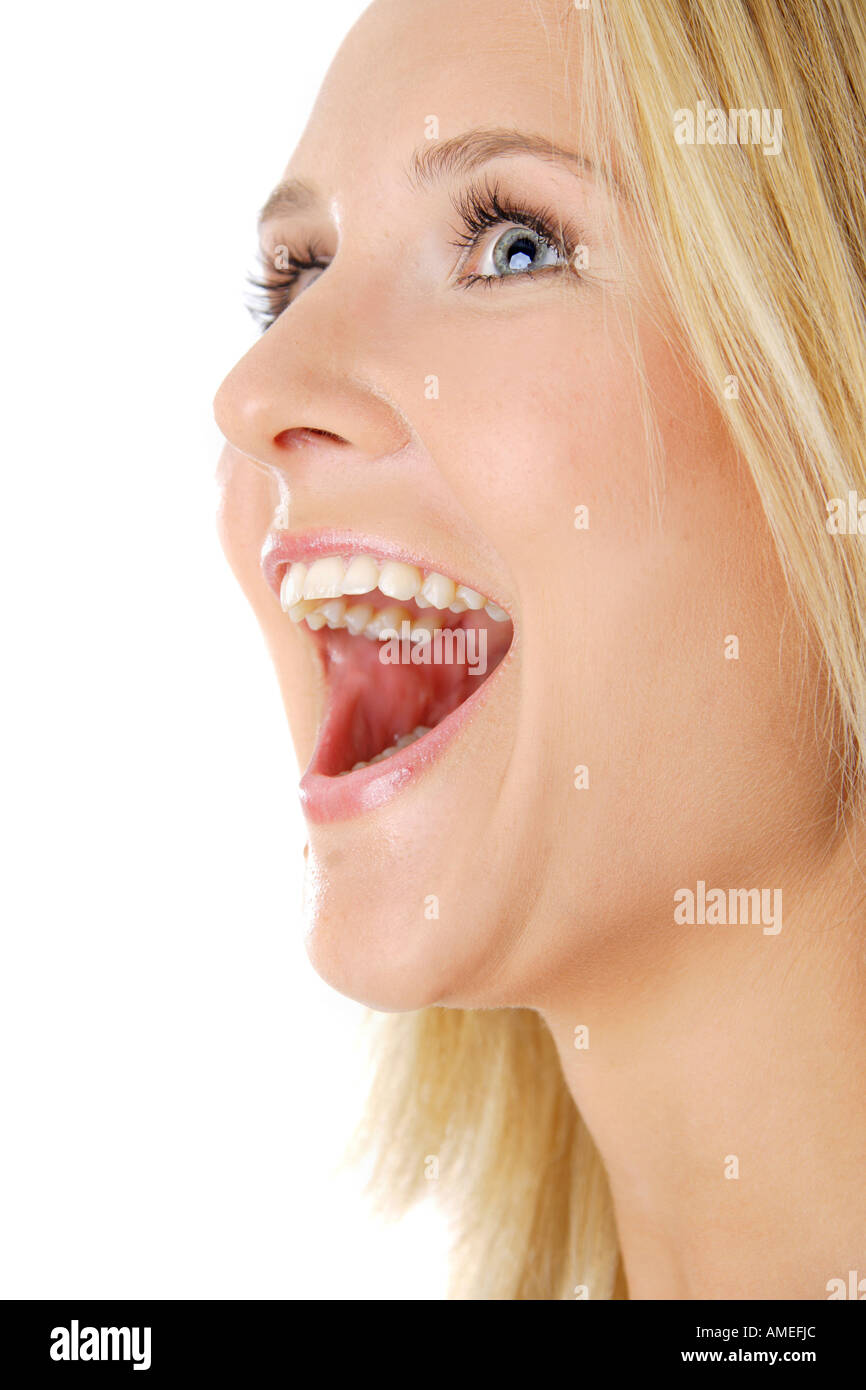 portrait of young, blond woman with wide opened mouth Stock Photo - Alamy