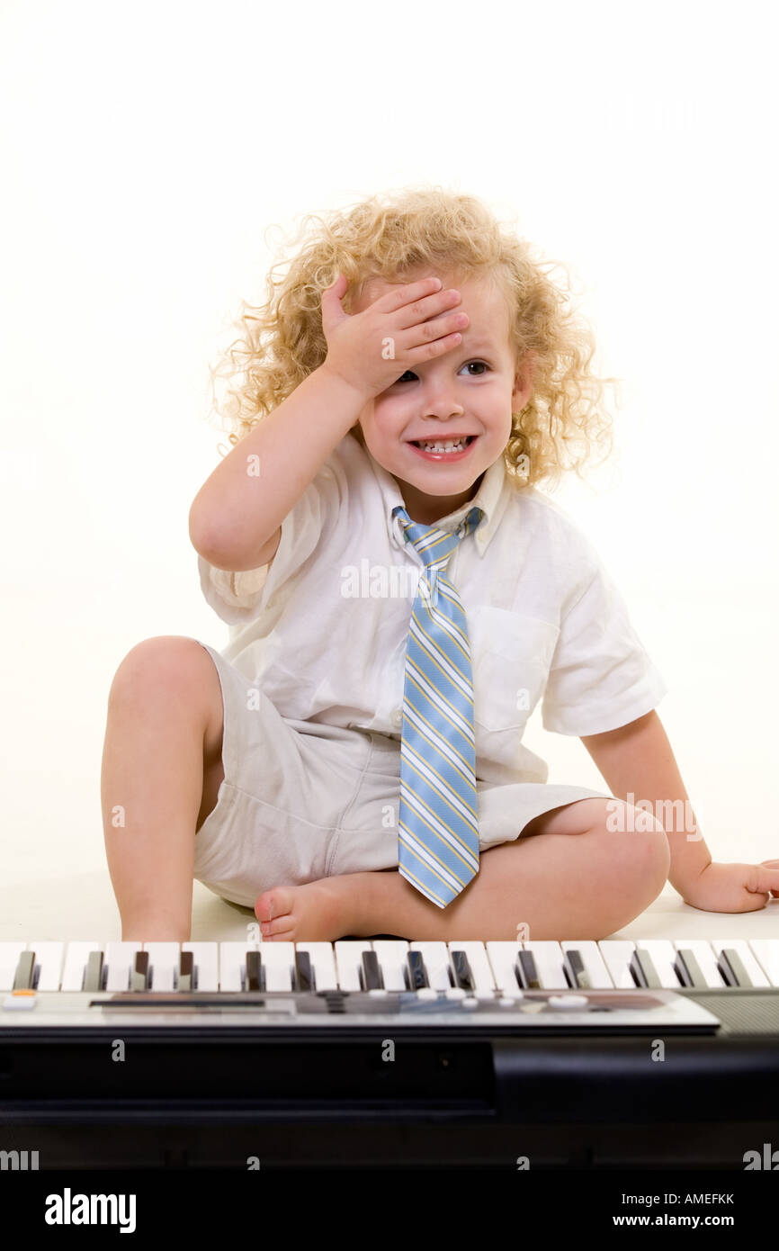 Boy playing keyboard Stock Photo - Alamy