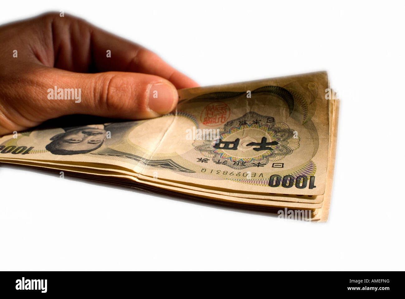 Yen notes and hand hi-res stock photography and images - Alamy