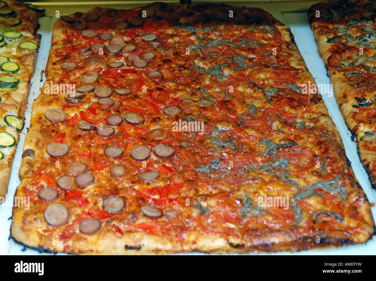 Pizza on display in an Italian bakery Stock Photo - Alamy