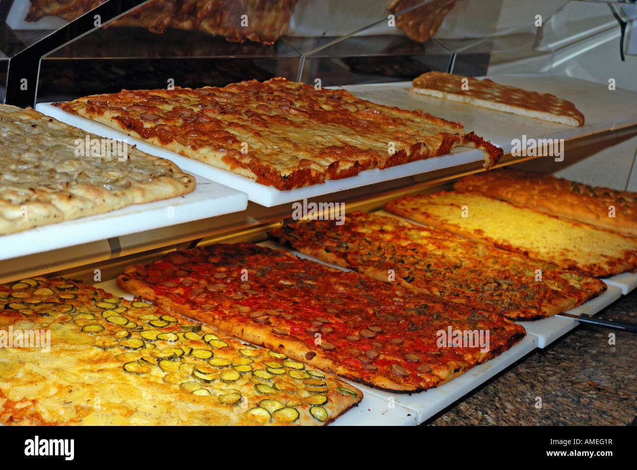 Pizza on display in an Italian bakery Stock Photo - Alamy