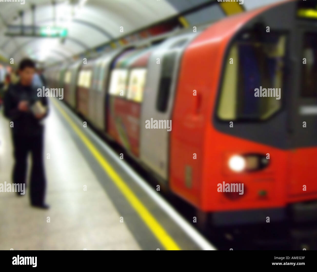 Tube Train at platform, the image is blurred Stock Photo - Alamy