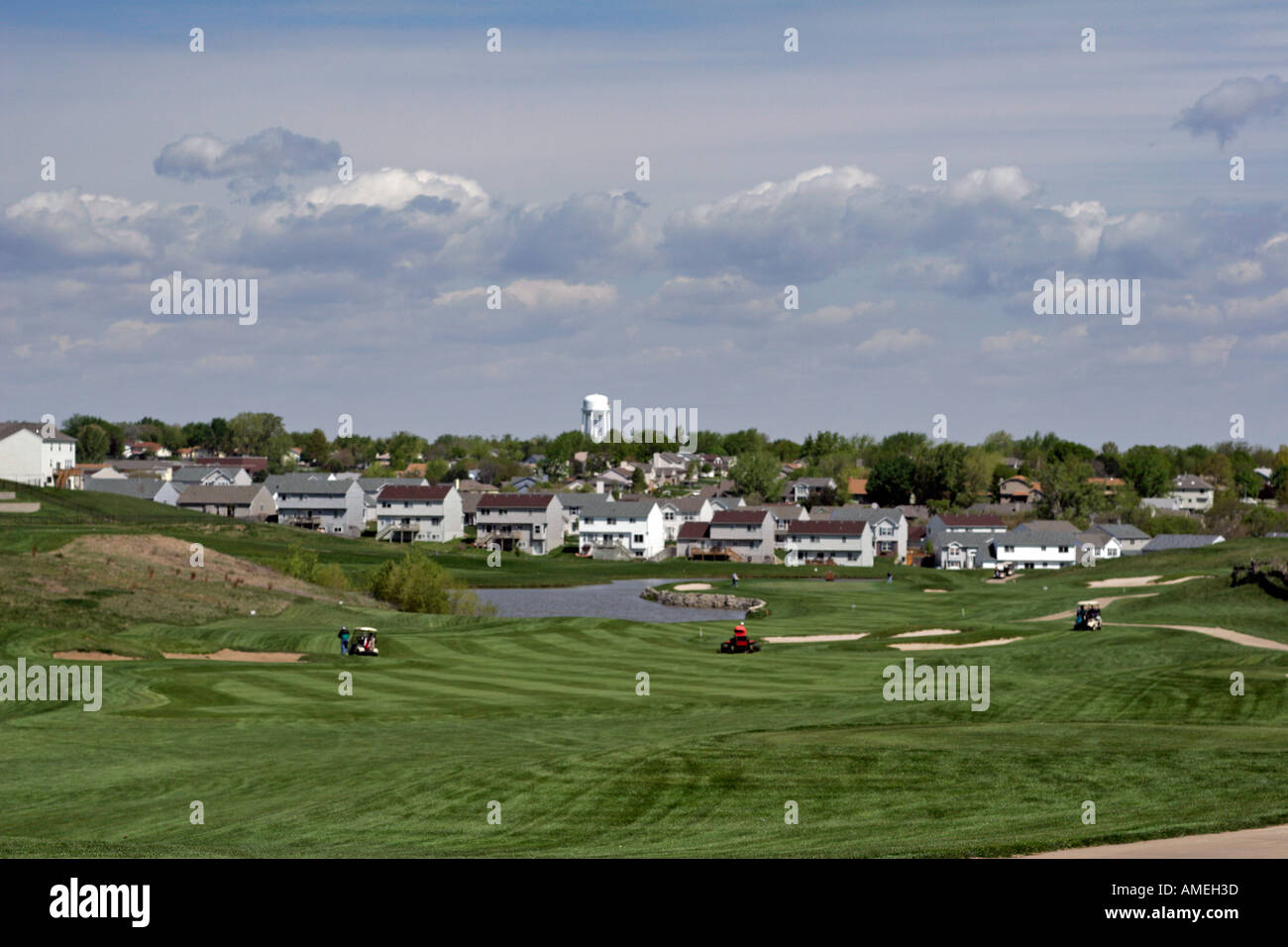 midwest neighborhood community town city plains clouds blue sky rolling ...