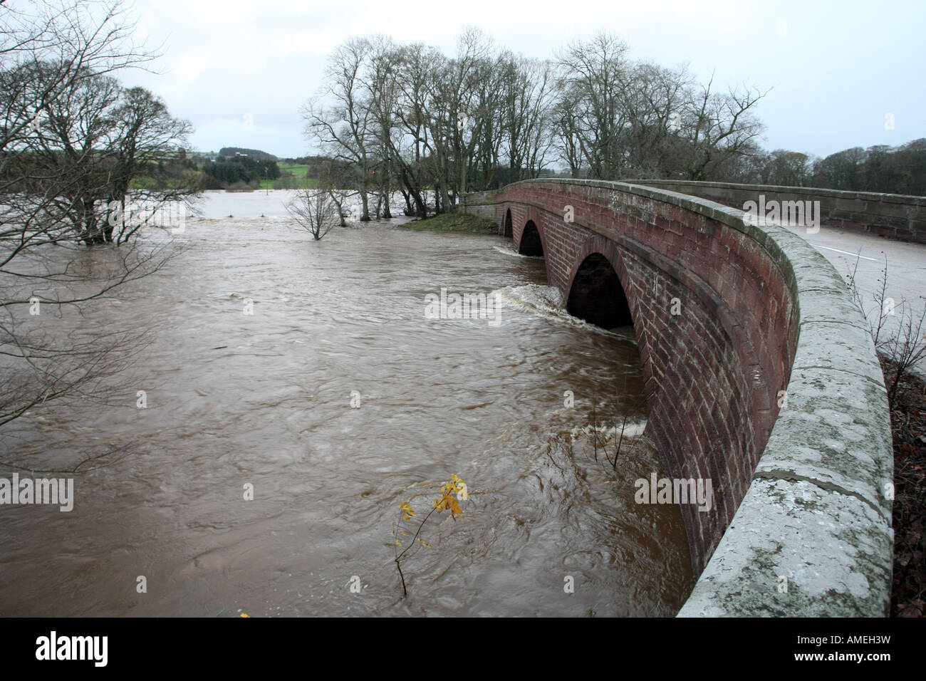 Flood waters of the River Deveron rise beneath a road bridge on the ...